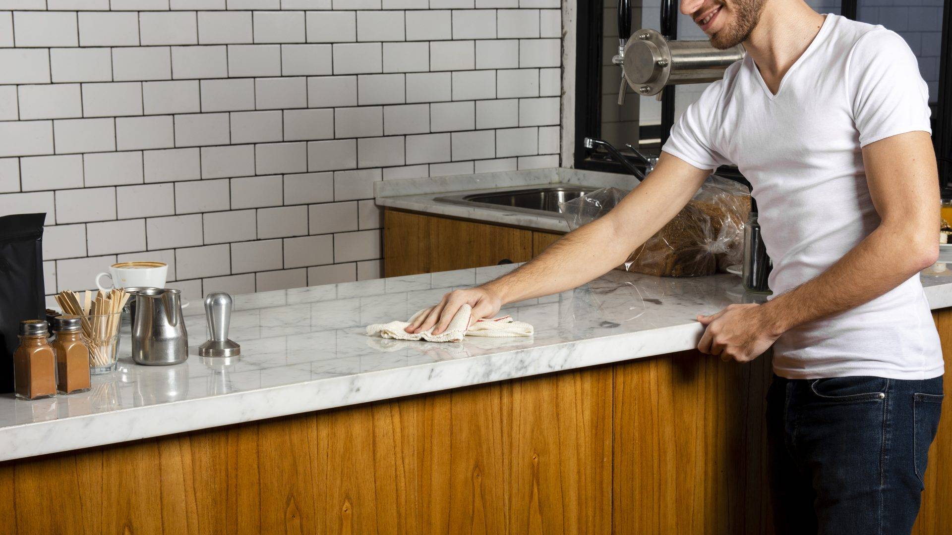bartender-wiping-worktop-with-cloth – Universal Countertop in ...